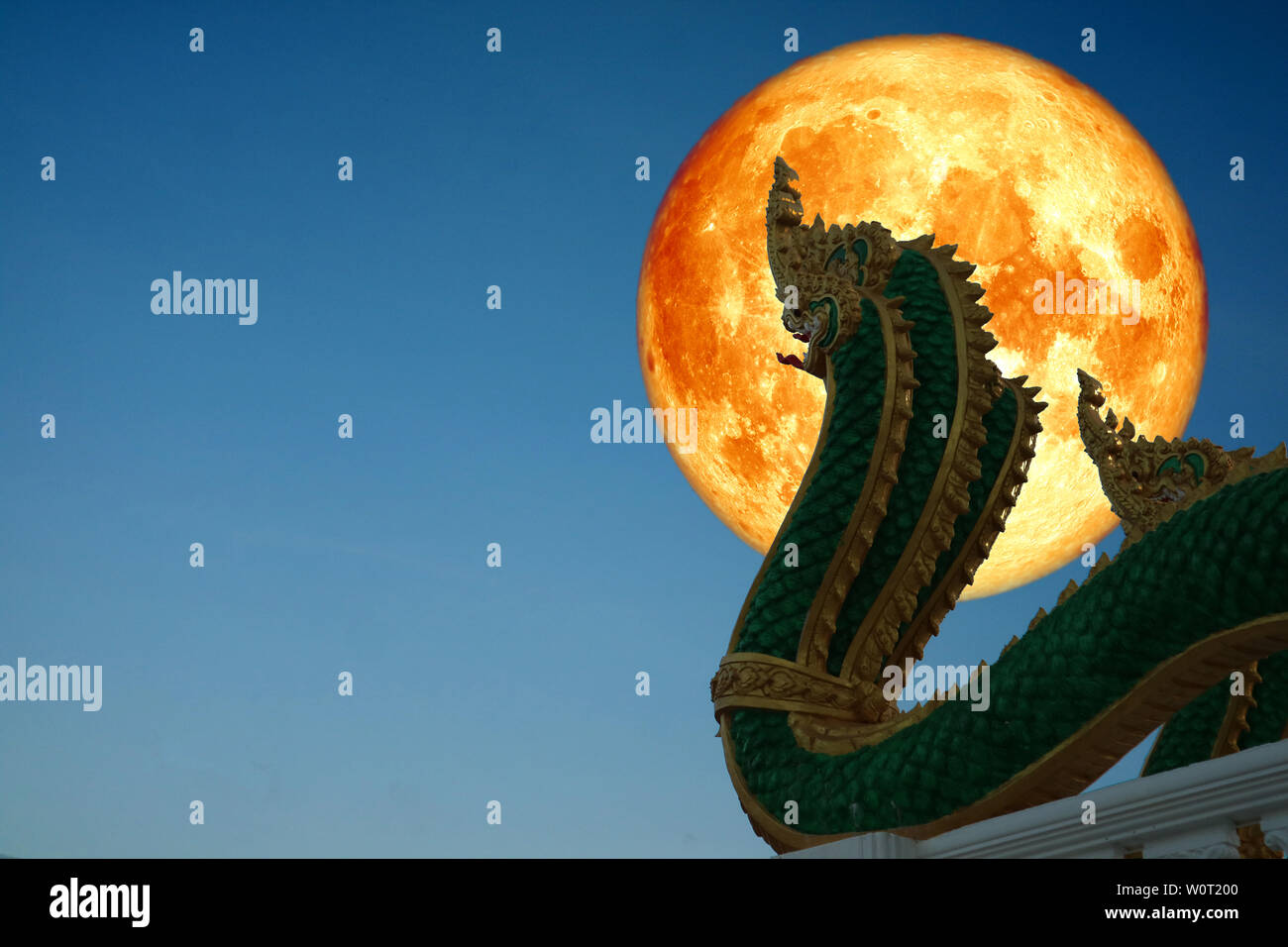 last full moon of winter back on silhouette Naga at buddhist temple on ...