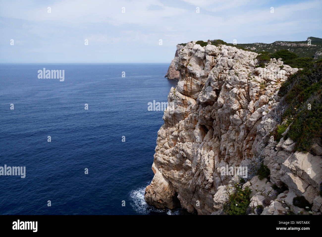 Capo Caccia, Foradada island. Imposing white limestone cliff, in ...