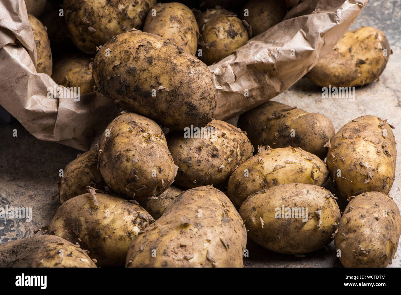 Cornish new potatoes, tumbling from the sack Stock Photo - Alamy