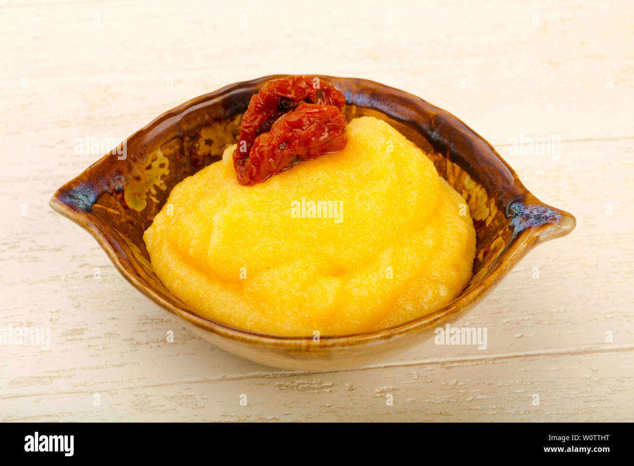 Polenta with dry tomato Stock Photo - Alamy