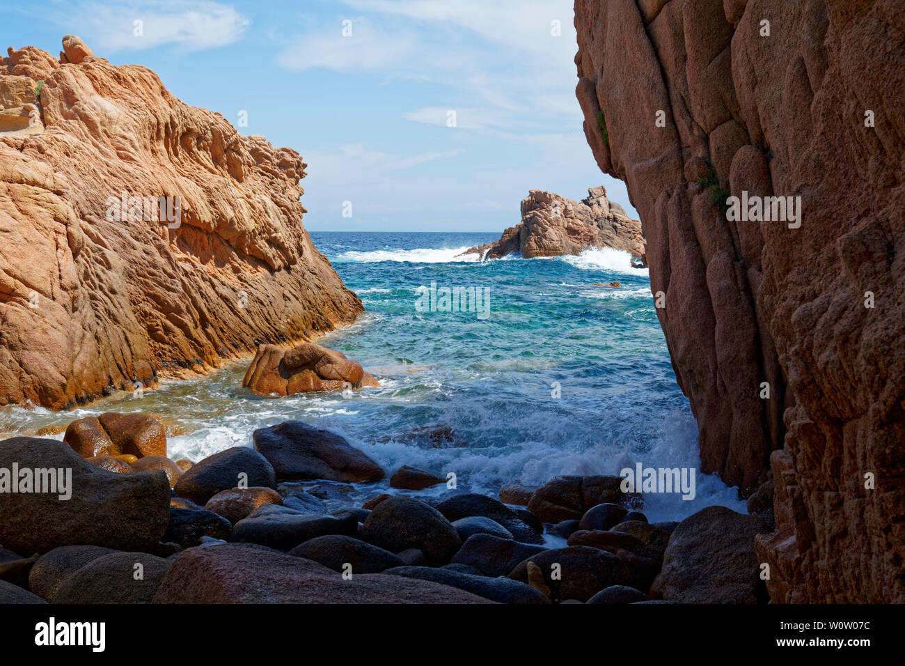 Red rock formation at a beach at Costa Paradiso in Sardinia (Italy ...