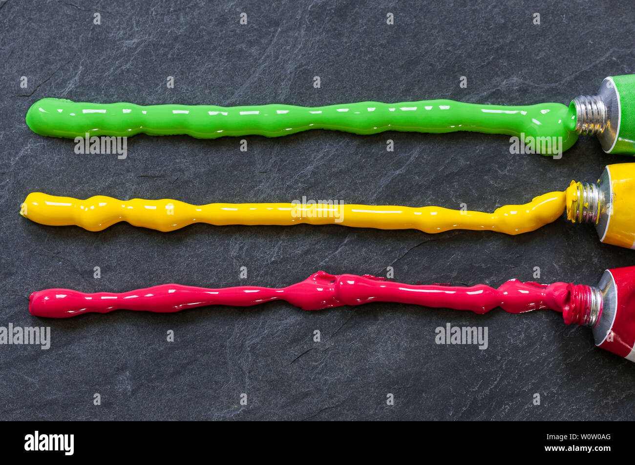 Background, black slate stone with texture and yellow, green, red line ...