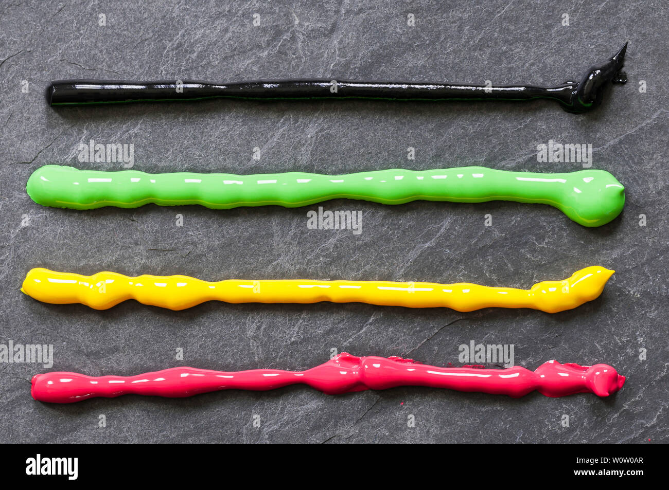Background, black slate stone with texture and yellow, green, black ...