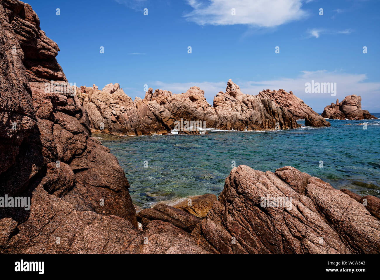 Red rock formation at a beach at Costa Paradiso in Sardinia (Italy ...