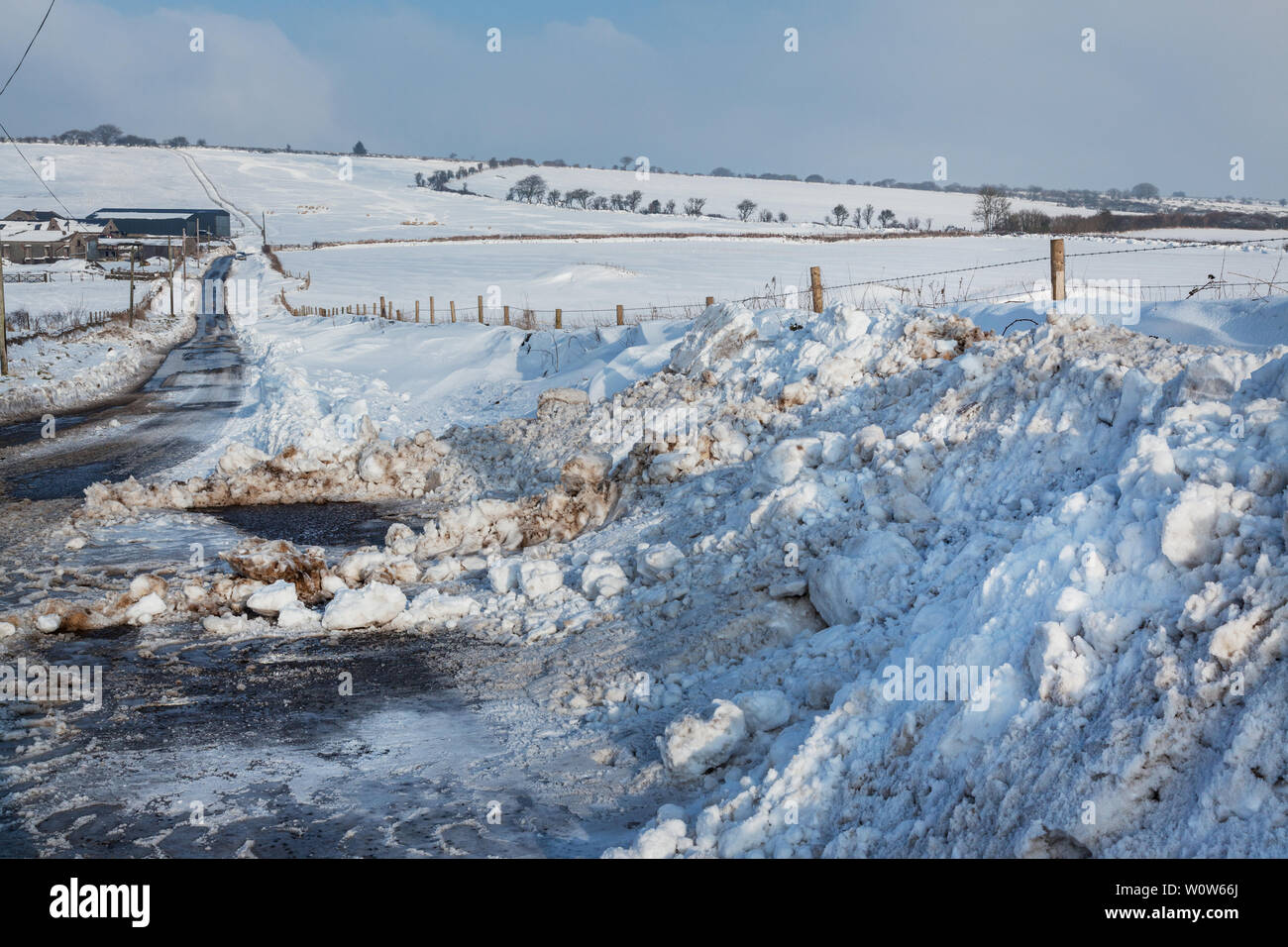 Winter landscape with road cleared of snow Stock Photo - Alamy
