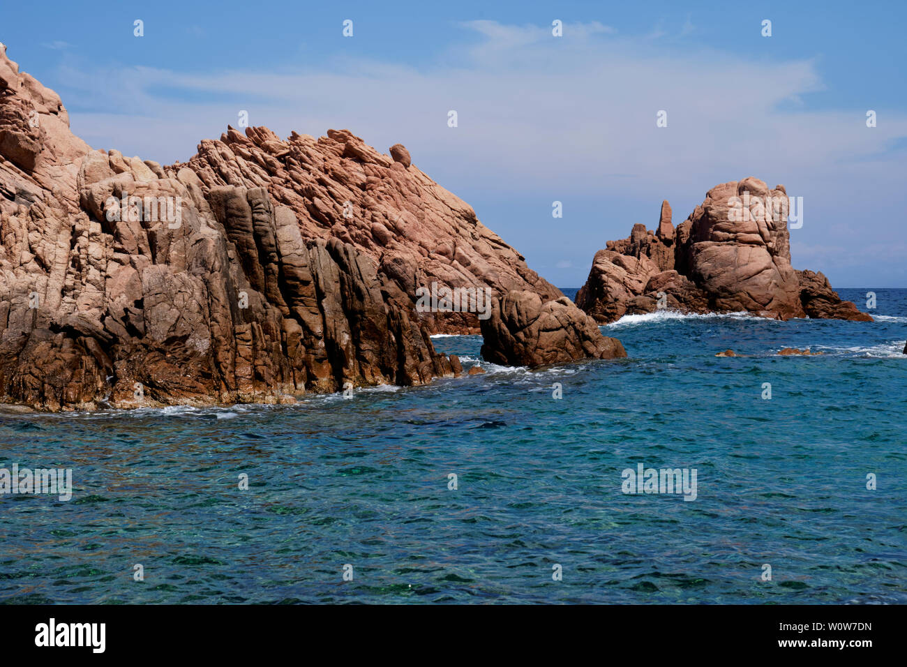 Red rock formation at a beach at Costa Paradiso in Sardinia (Italy ...