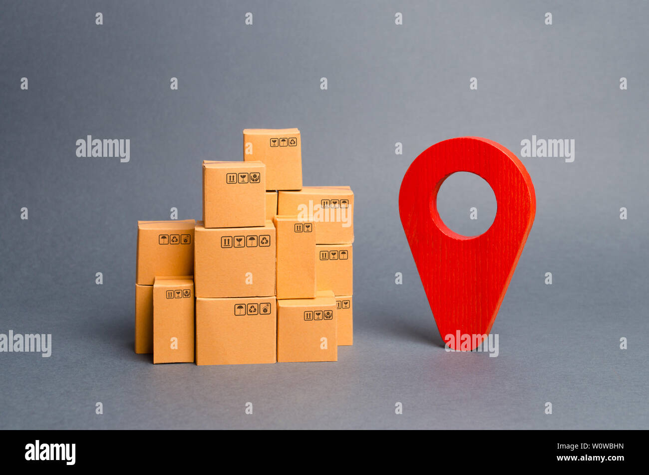 Lots of cardboard boxes and a red position pin. Locating packages and ...
