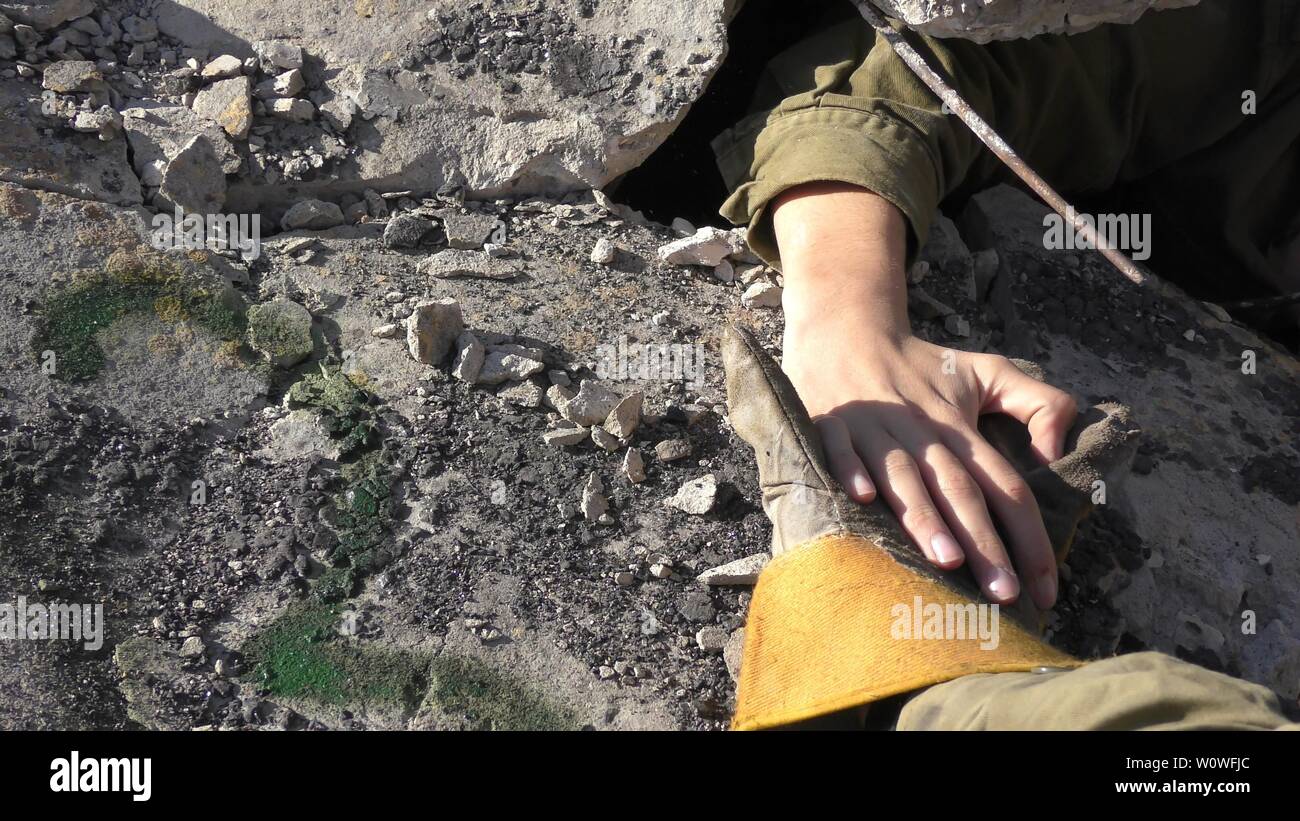 Israeli Homeland Security Soldier paramedic holds the hand of another ...