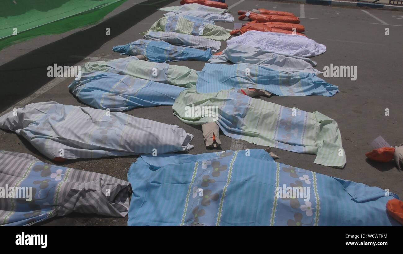 Horror view of dead corpses of mannequins, wrapped in hospital sheets ...