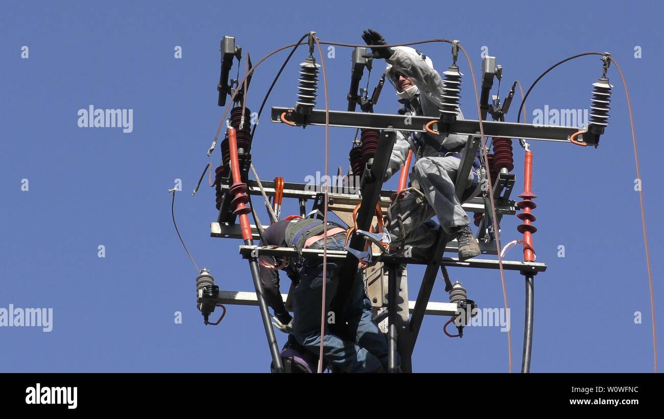Electricians of the Israeli Electric Co fixing high voltage electrical ...