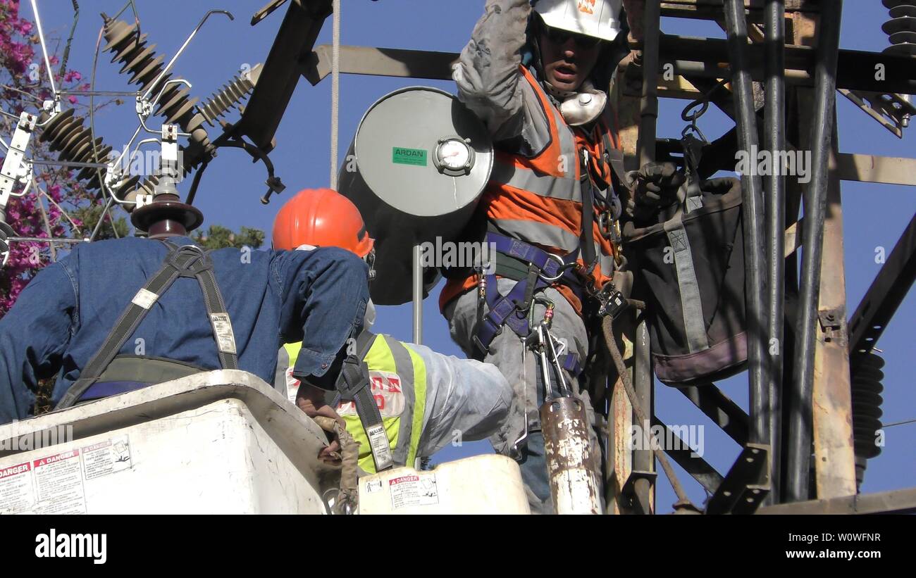 Electricians of the Israeli Electric Co fixing high voltage electrical ...