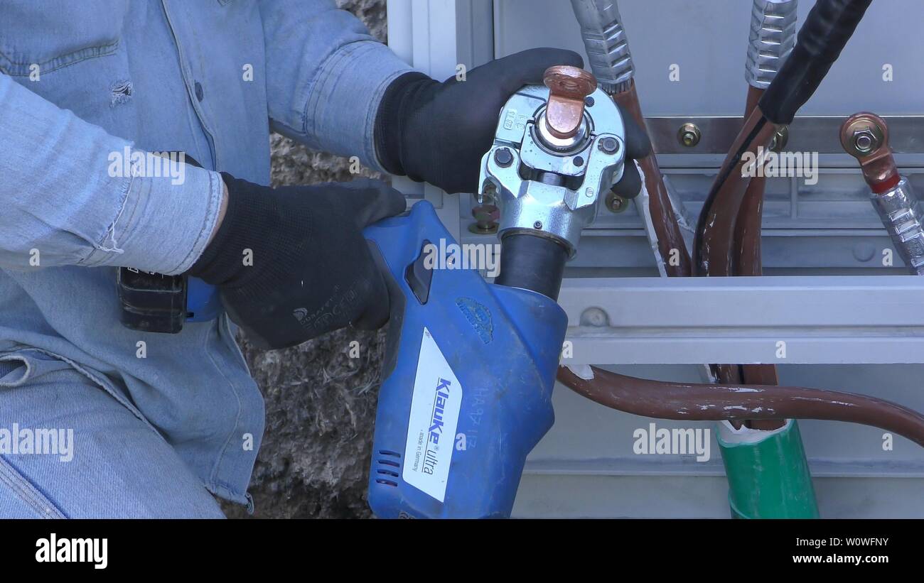 Engineers of the Israeli Electric Co fixing high voltage electrical ...