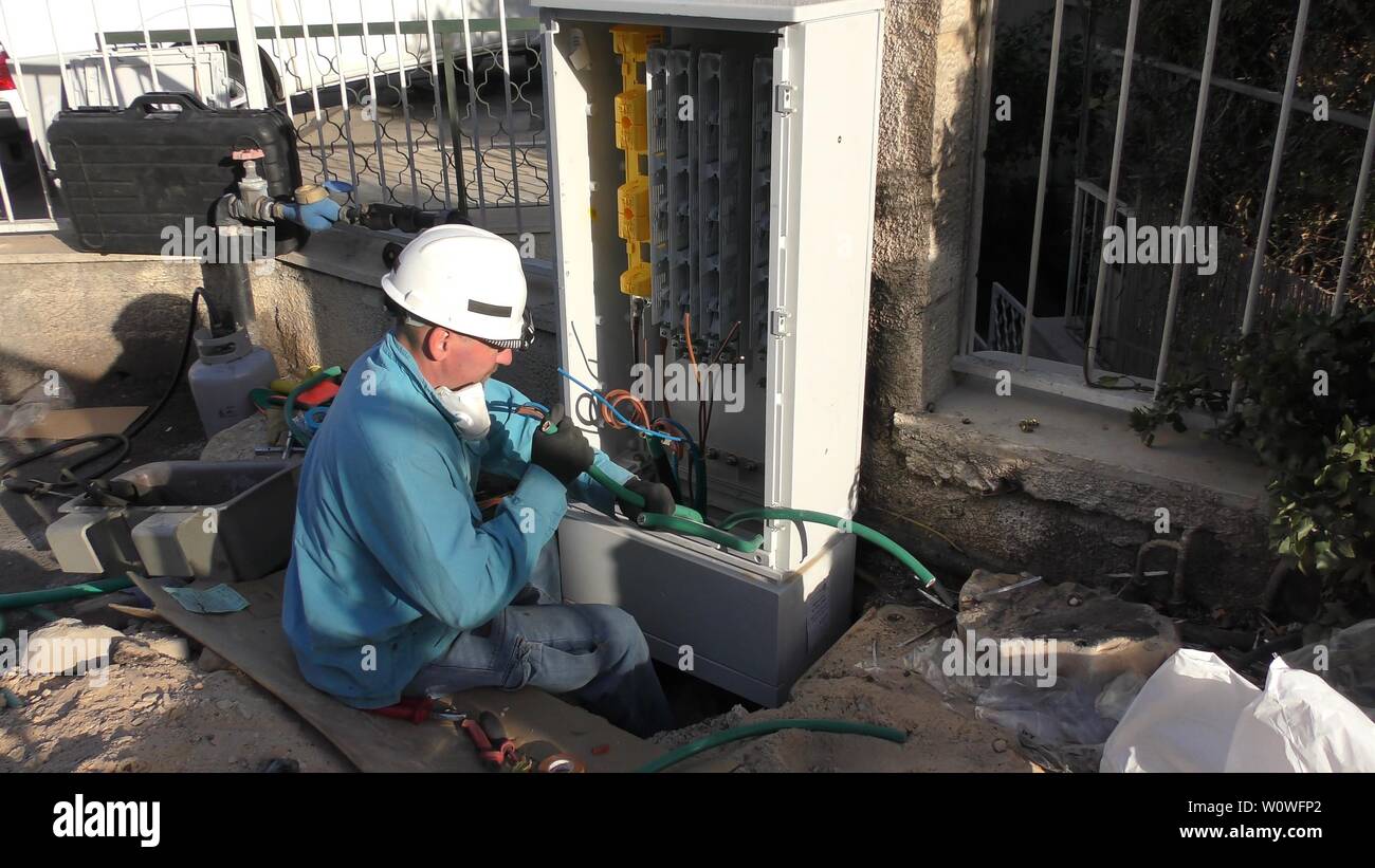 Engineers of the Israeli Electric Co fixing high voltage electrical ...