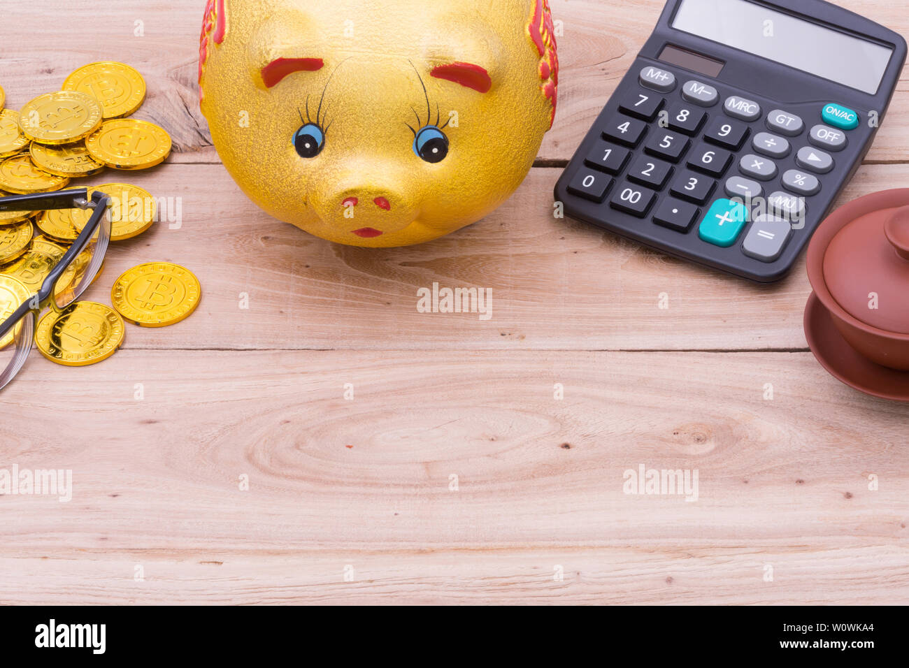 Piglet piggy bank on wooden table Stock Photo - Alamy