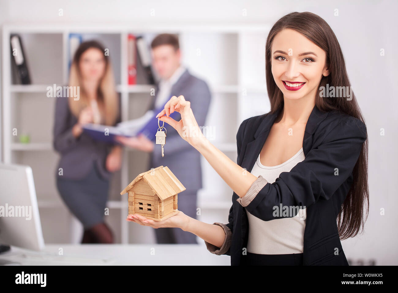 Real estate agent portrait with family getting new home. business ...