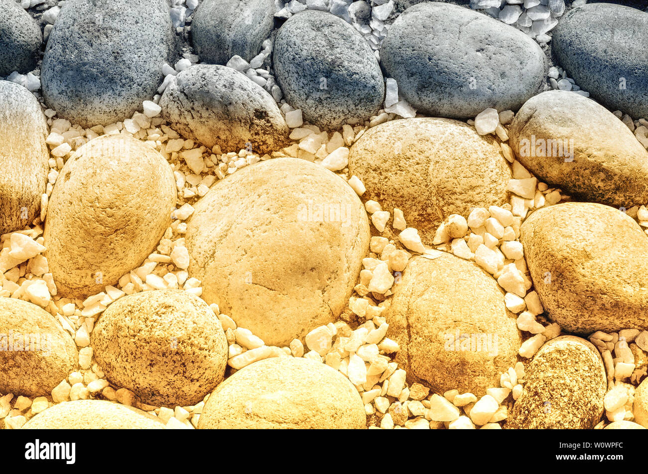 Two-color texture of large and small stones, tinted Stock Photo - Alamy
