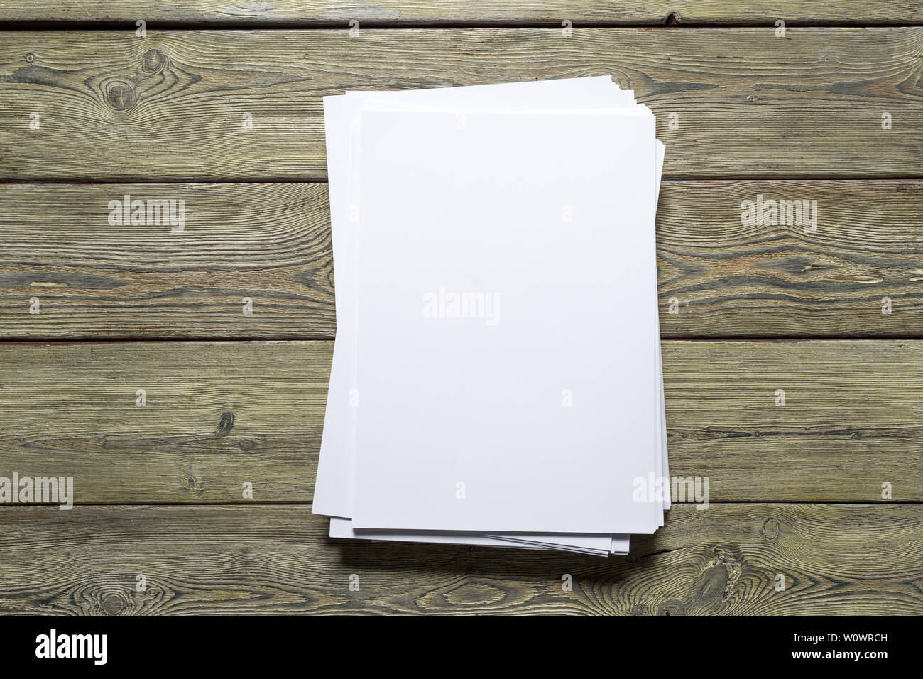 White business card on wooden table. Blank portrait A4 Stock Photo - Alamy