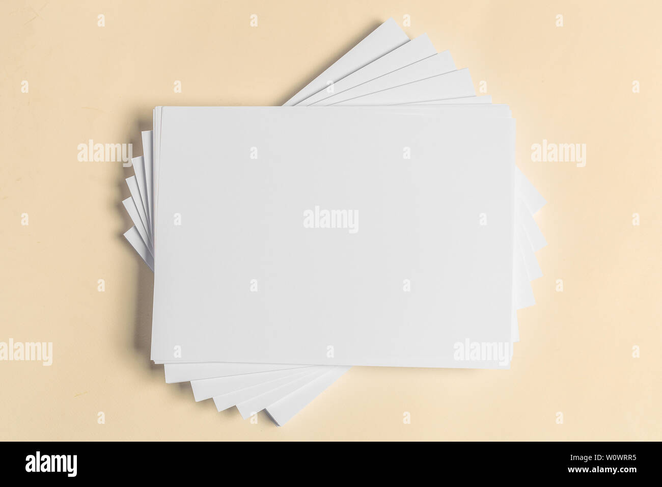 White business card on wooden table. Blank portrait A4 Stock Photo - Alamy