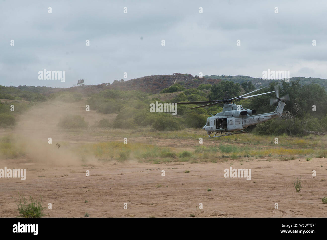 U.S. Marines with Light Attack Helicopter Squadron (HMLA) 469 take off ...