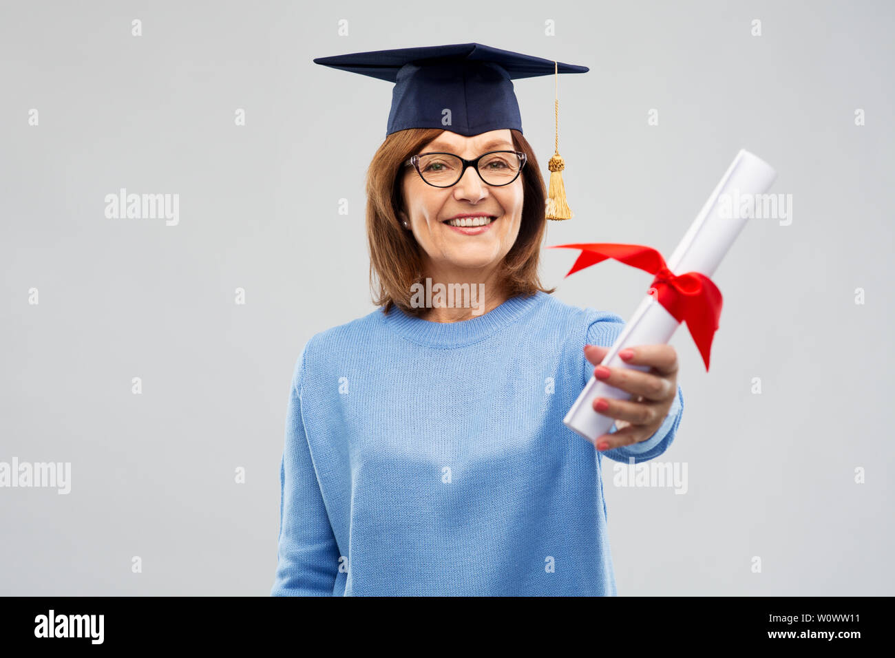 happy senior graduate student woman with diploma Stock Photo - Alamy