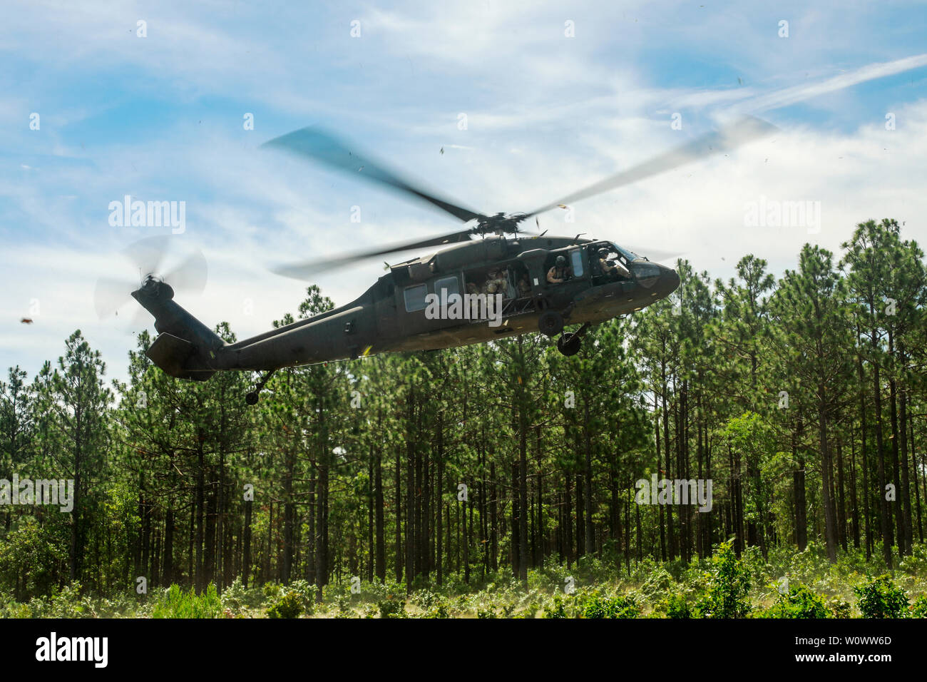U.S. Army Reserve Soldiers approach the landing zone in a UH-60 ...