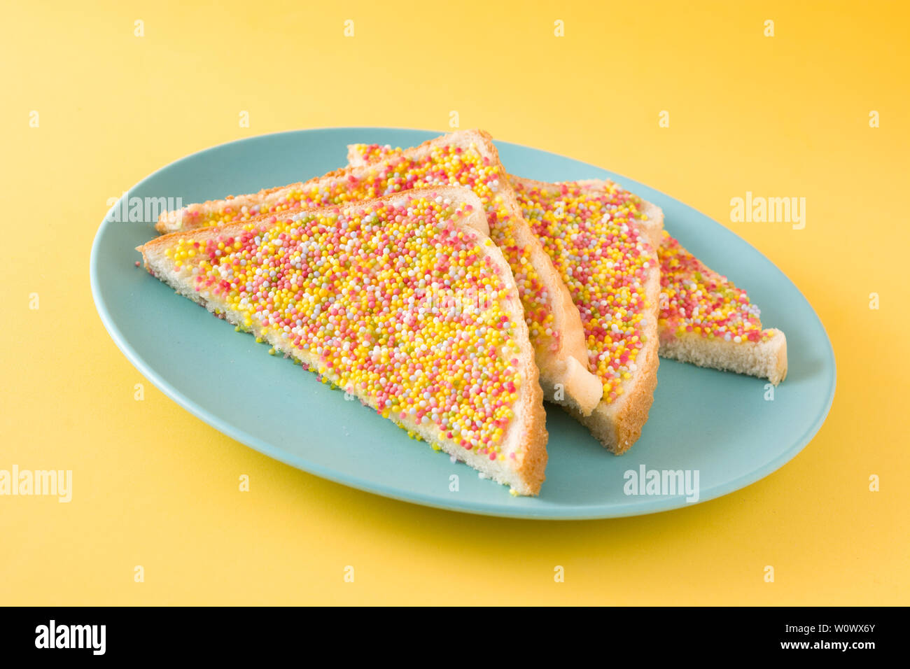 Traditional Australian fairy bread on yellow background Stock Photo - Alamy