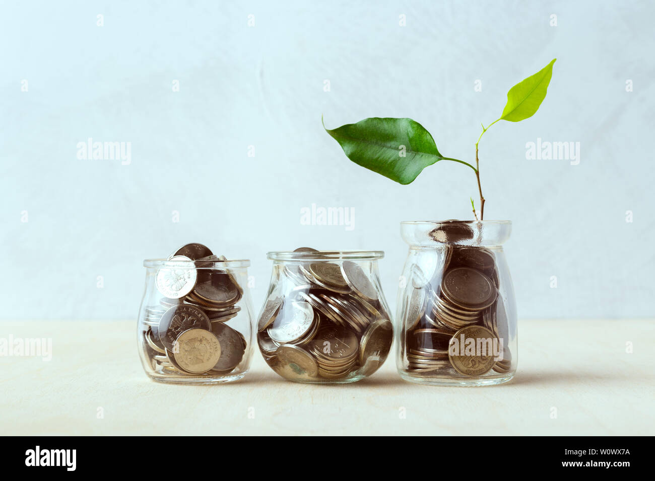 Coins in Glass Bottles, Savings Money Ideas Stock Photo - Alamy