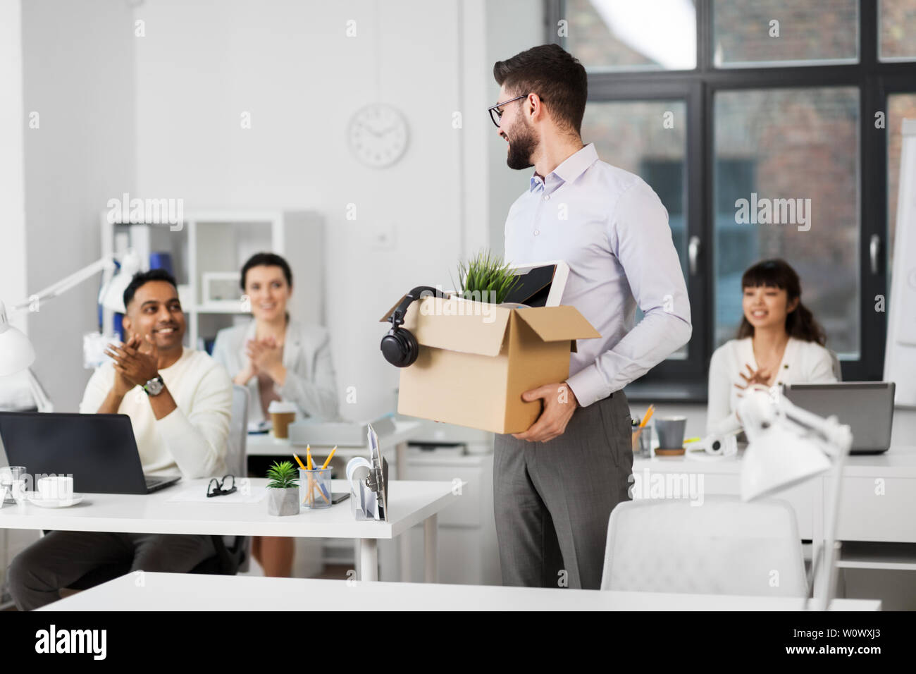 office workers applauding to male colleague Stock Photo - Alamy