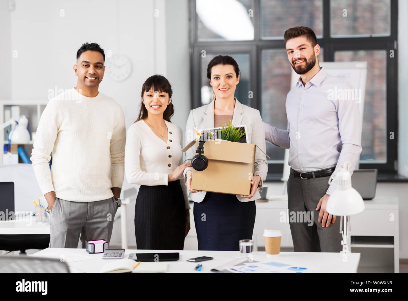 new female employee with colleagues at office Stock Photo - Alamy
