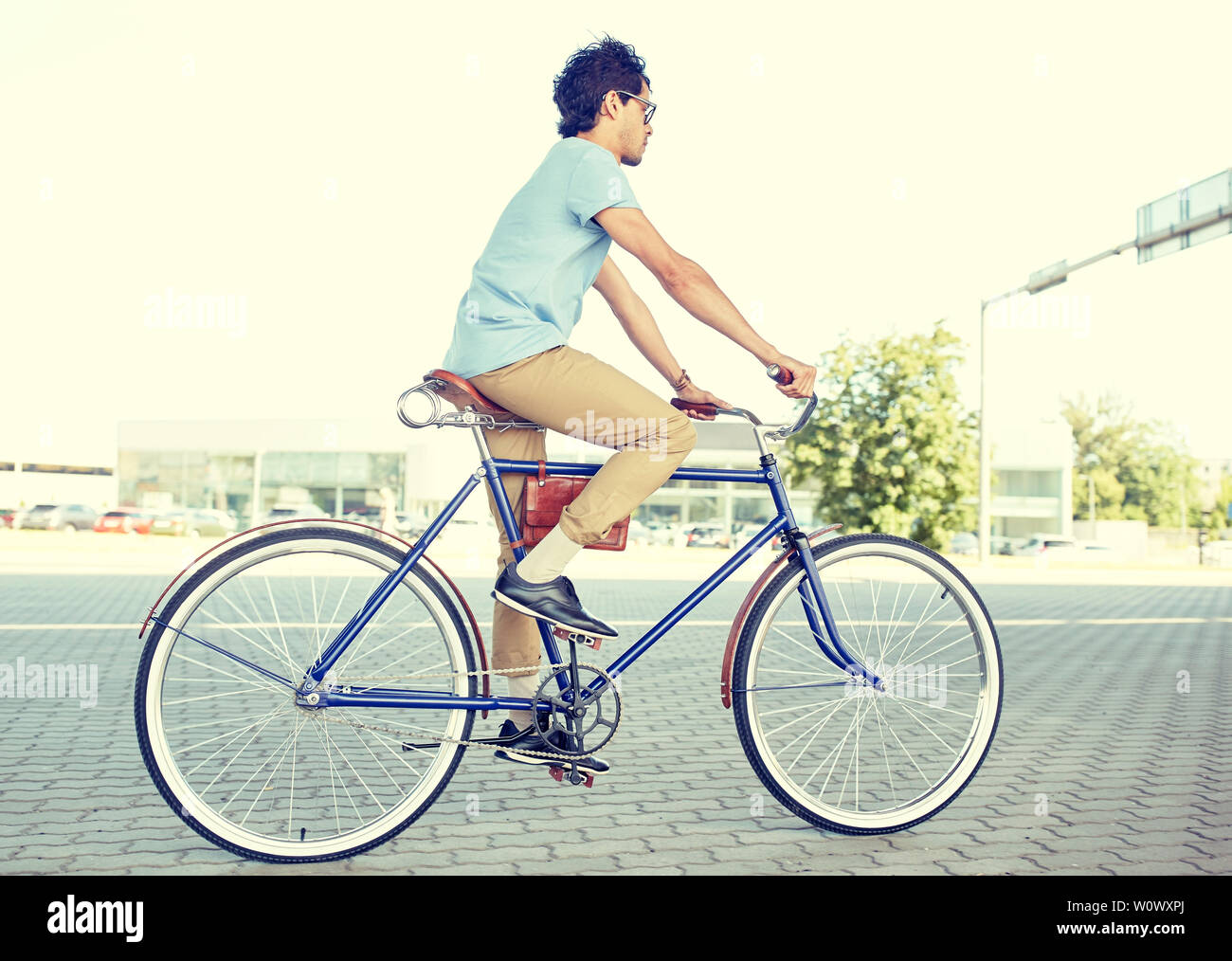 young hipster man riding fixed gear bike Stock Photo - Alamy