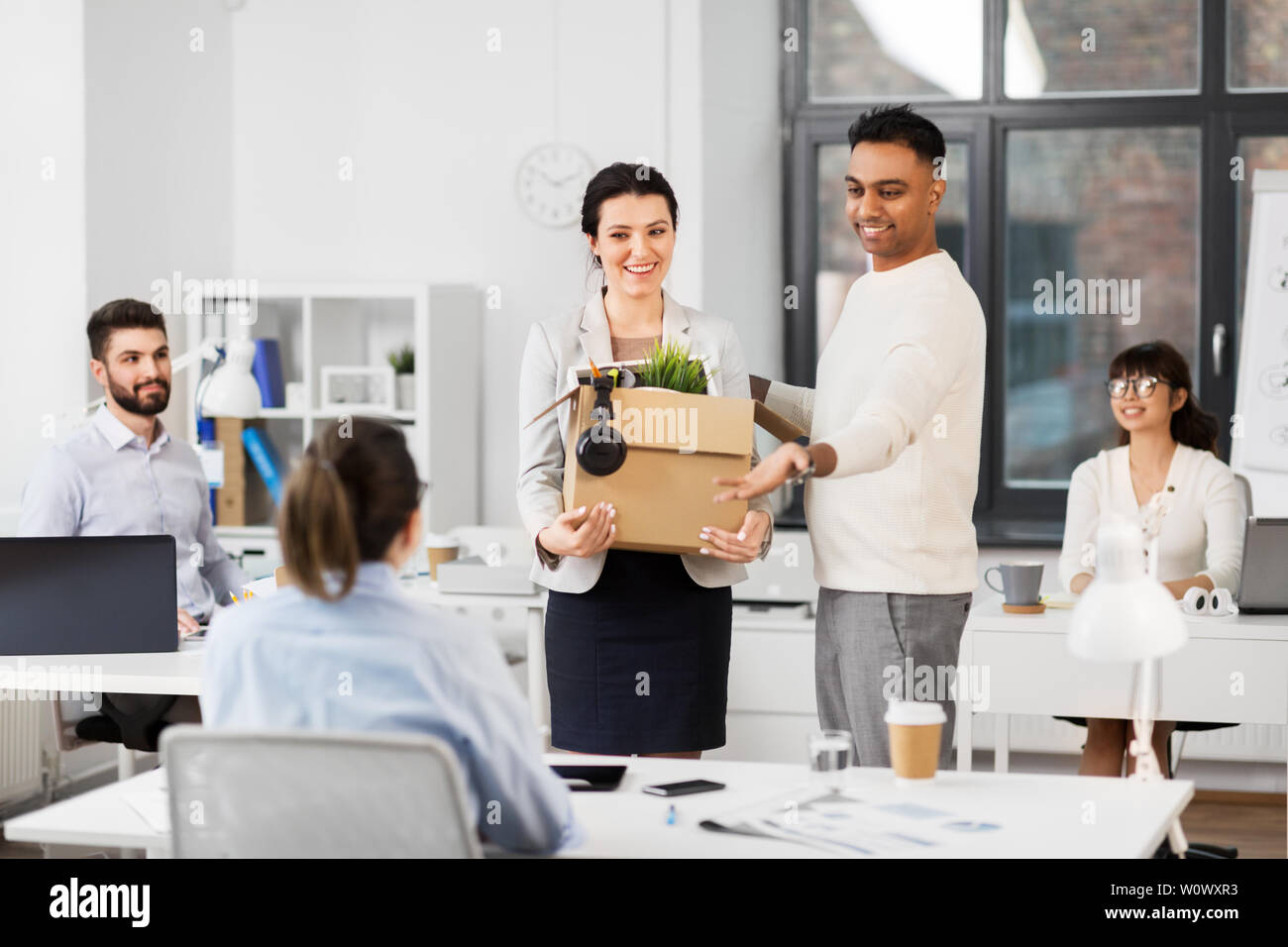 new female employee meeting colleagues at office Stock Photo - Alamy