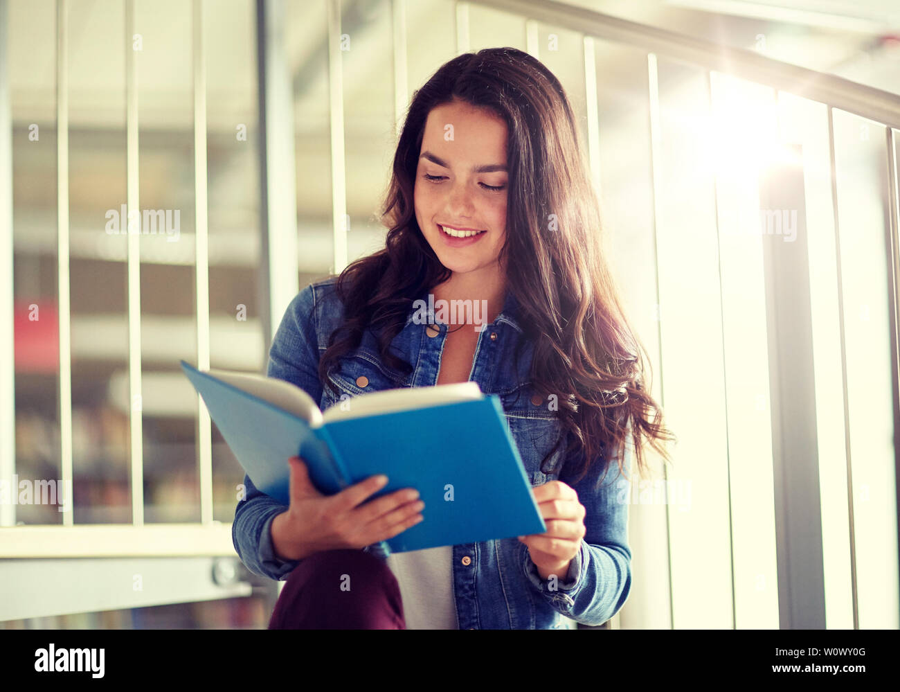 high school student girl reading book at library Stock Photo - Alamy