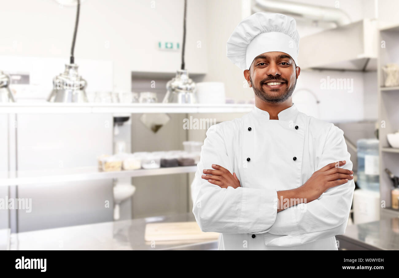 happy indian chef in toque at restaurant kitchen Stock Photo - Alamy