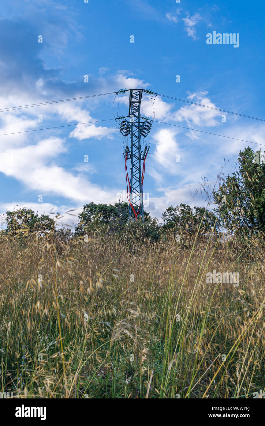 Small high voltage tower in the countryside Stock Photo - Alamy