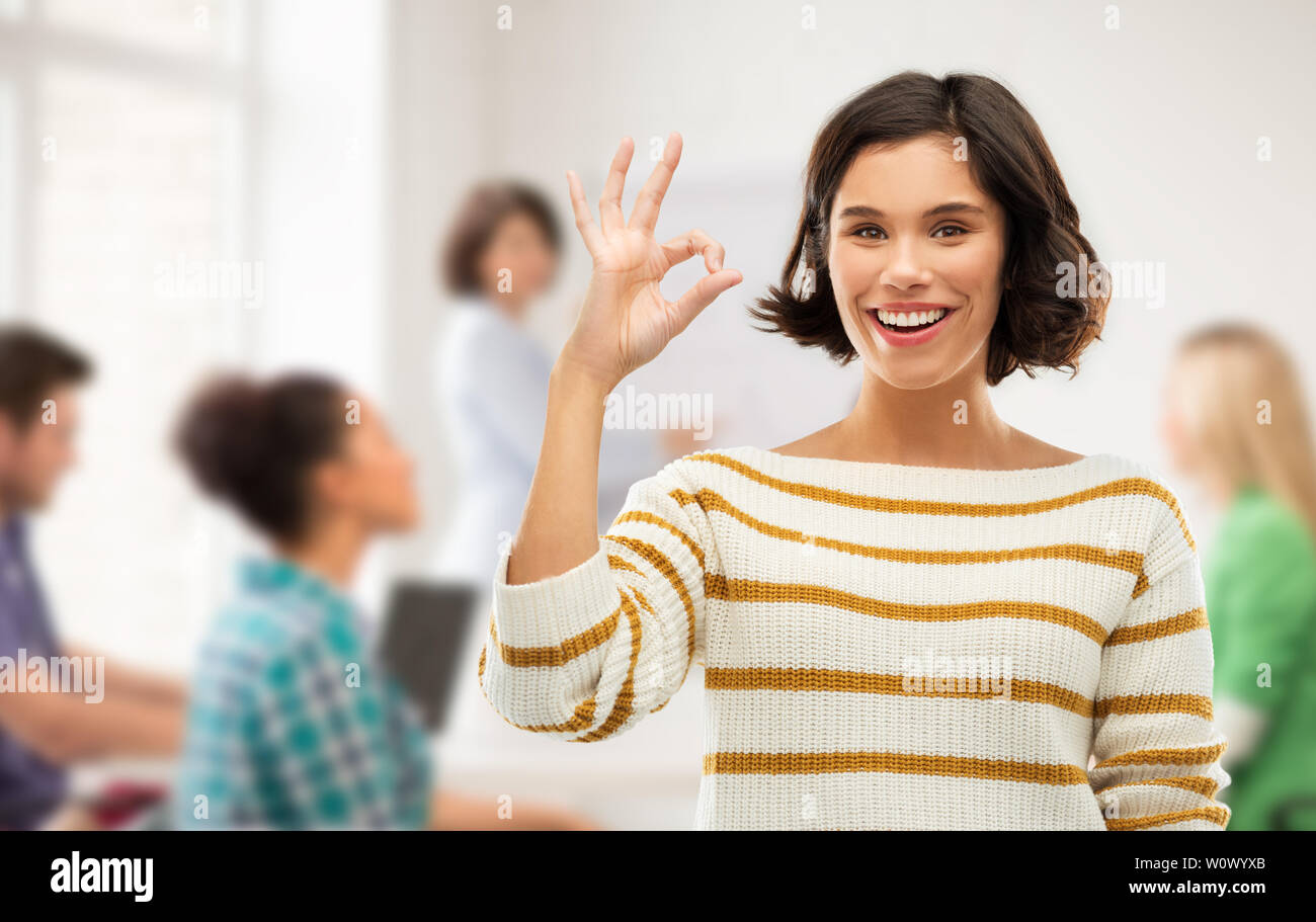 happy smiling student girl showing ok at school Stock Photo - Alamy