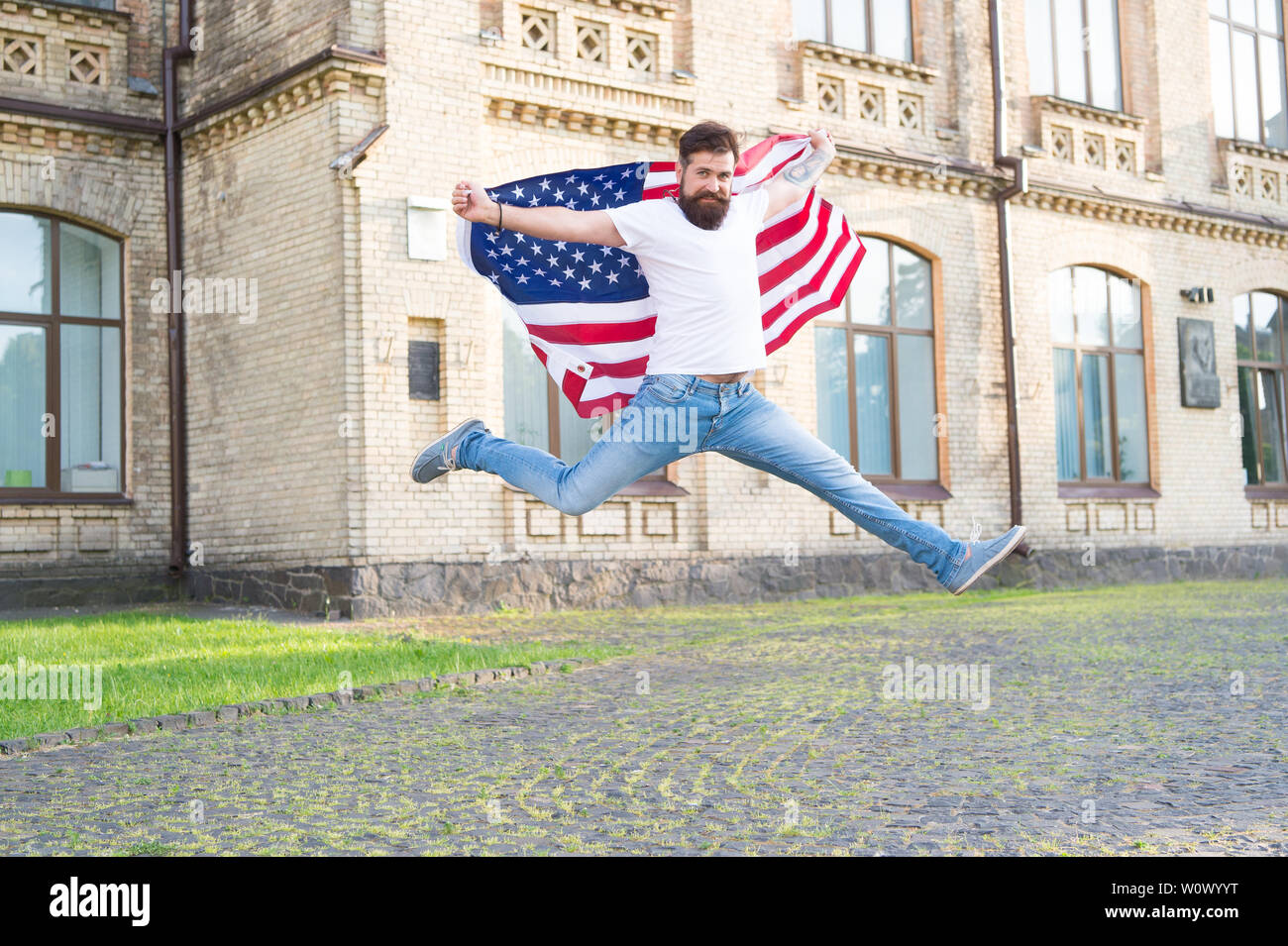 Join celebration. Patriotic guy expressing happiness in street ...