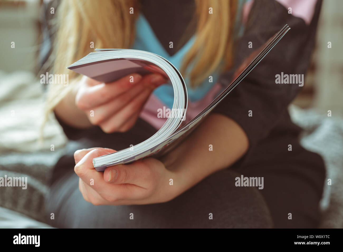 woman reading magazine at home Stock Photo - Alamy