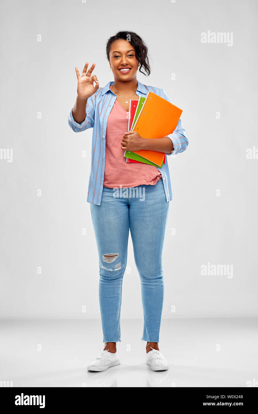 african american student woman with notebooks Stock Photo - Alamy