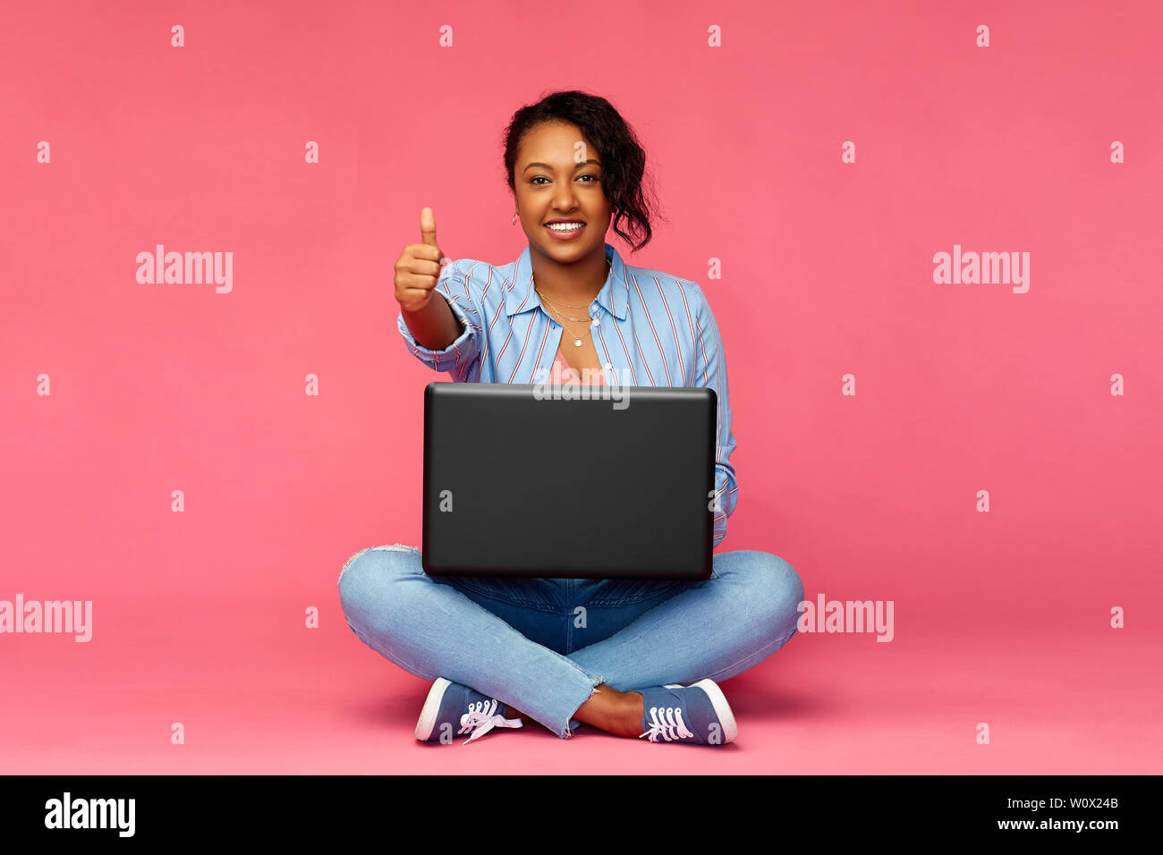 happy african american woman with laptop computer Stock Photo - Alamy