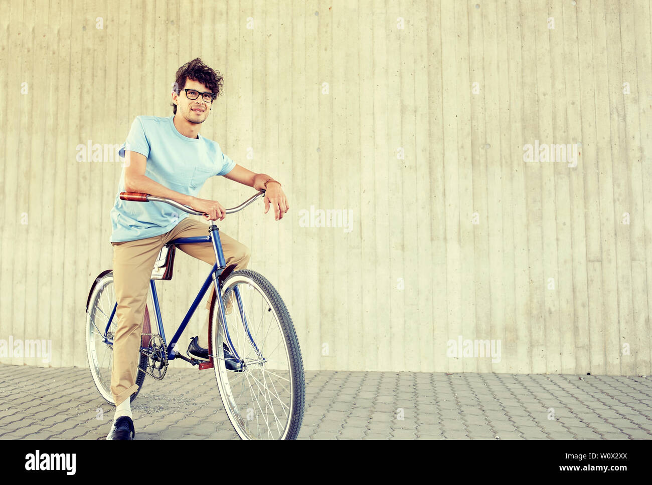 young hipster man riding fixed gear bike Stock Photo - Alamy