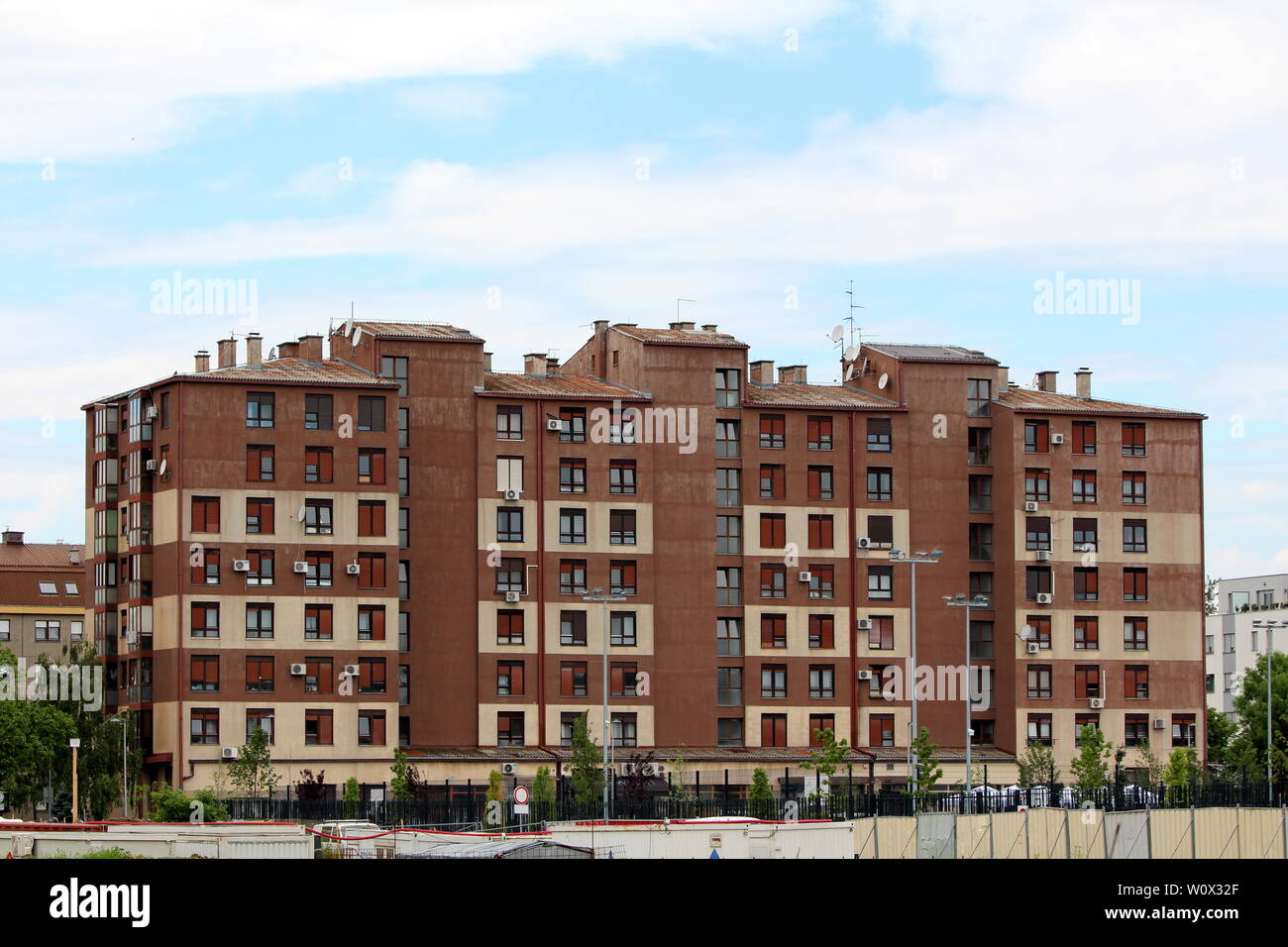 Dilapidated old seven story apartment building surrounded with ...