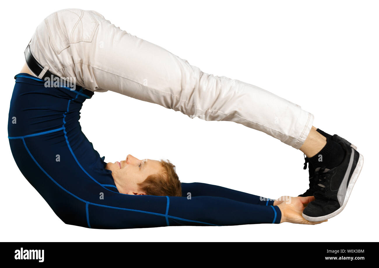 Flexible sporty young man doing stretching exercises isolated on white ...