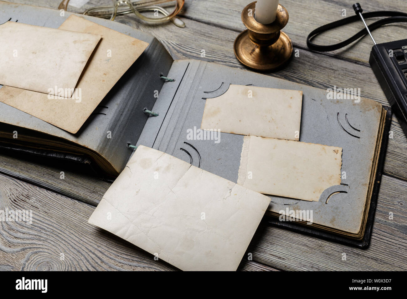 retro some old photos on wooden table Stock Photo - Alamy
