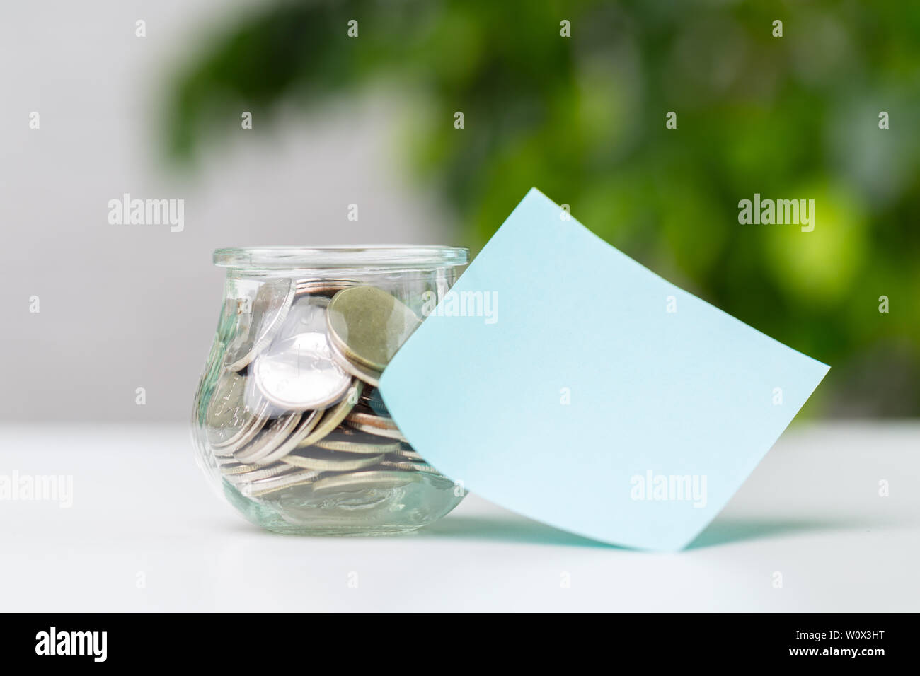 Coins in Glass Bottles Stock Photo - Alamy