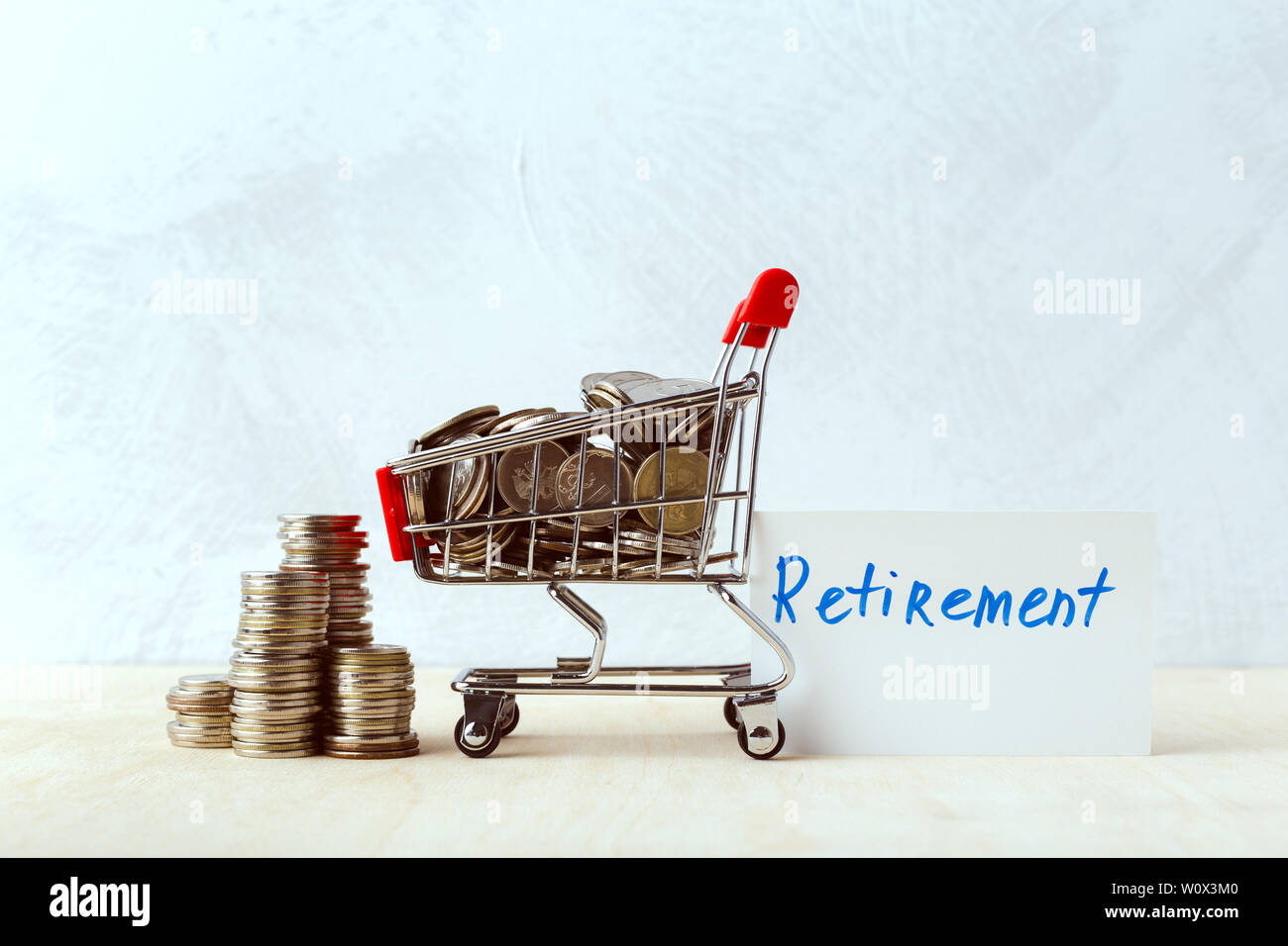 Saving Money Concept. Shopping trolley or cart with coin Stock Photo ...