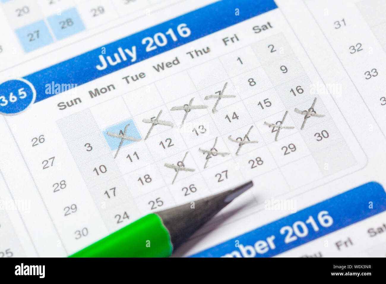 Closeup of dates on calendar page Stock Photo - Alamy