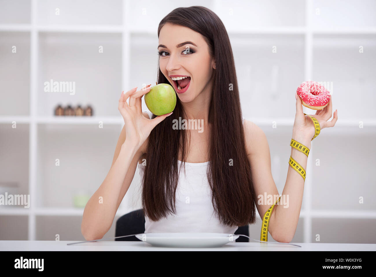 Diet. The concept of healthy and unhealthy nutrition. The model plus ...