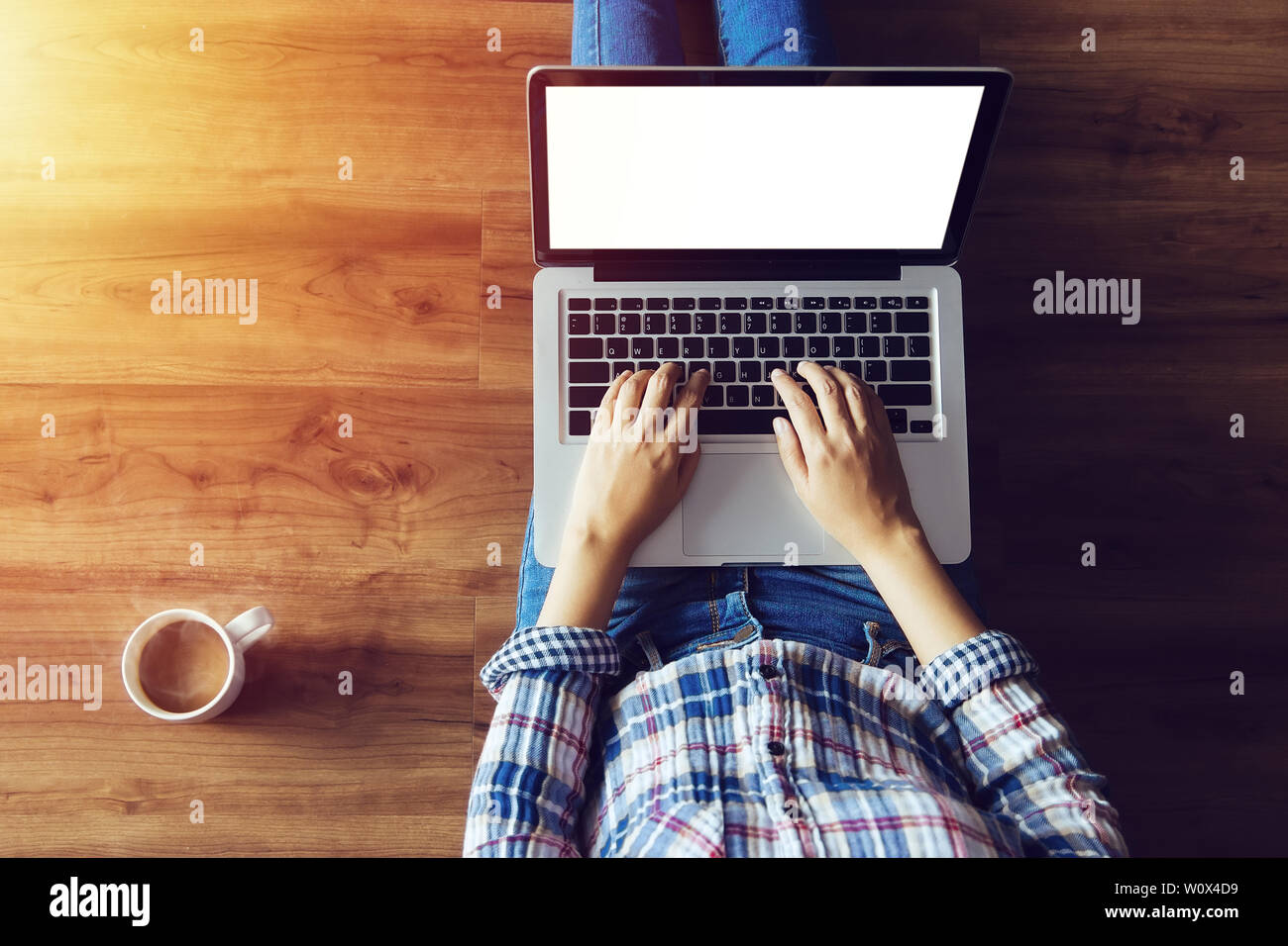 top view of people typing on laptop computer with blank white screen ...