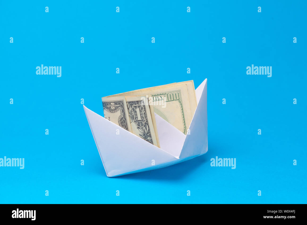 Money banknotes and paper boats. Business concept Stock Photo - Alamy