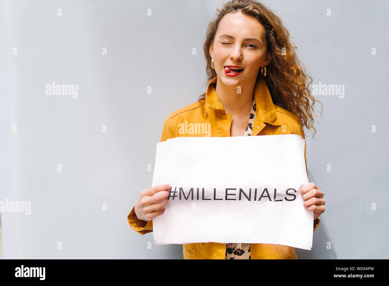 Young millennial teenage with red hair and a funny expression ,making ...